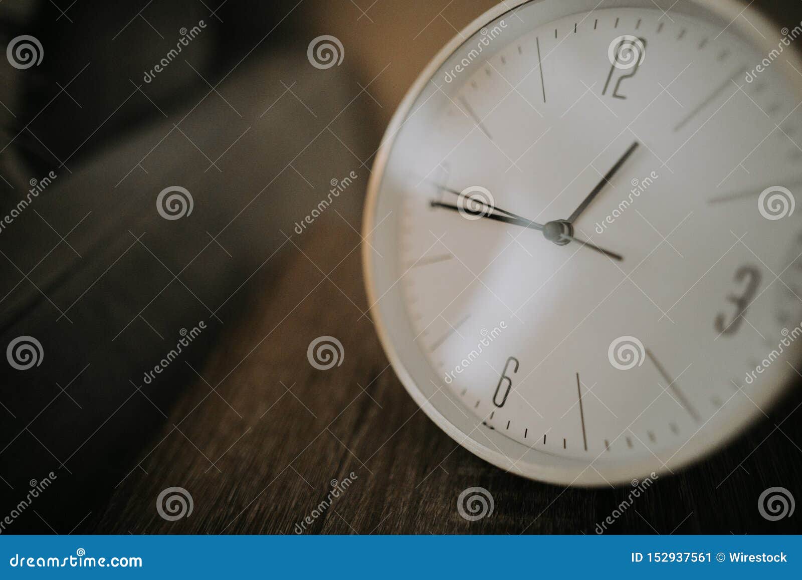 Closeup of a White Clock on a Wooden Brown Surface Stock Image - Image ...
