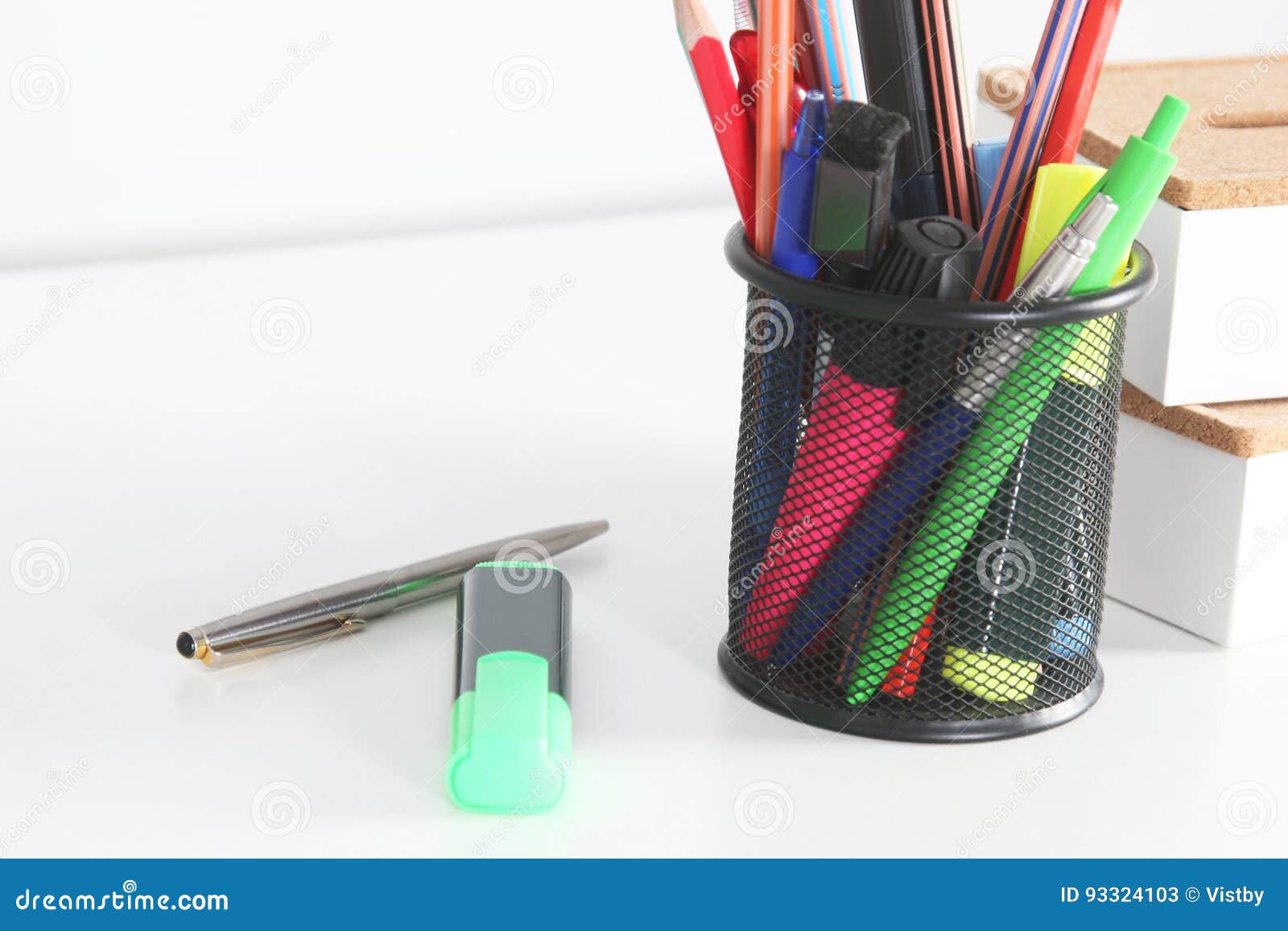 Closeup of White Desktop with Notepads, Pen and Other Items. Selective ...