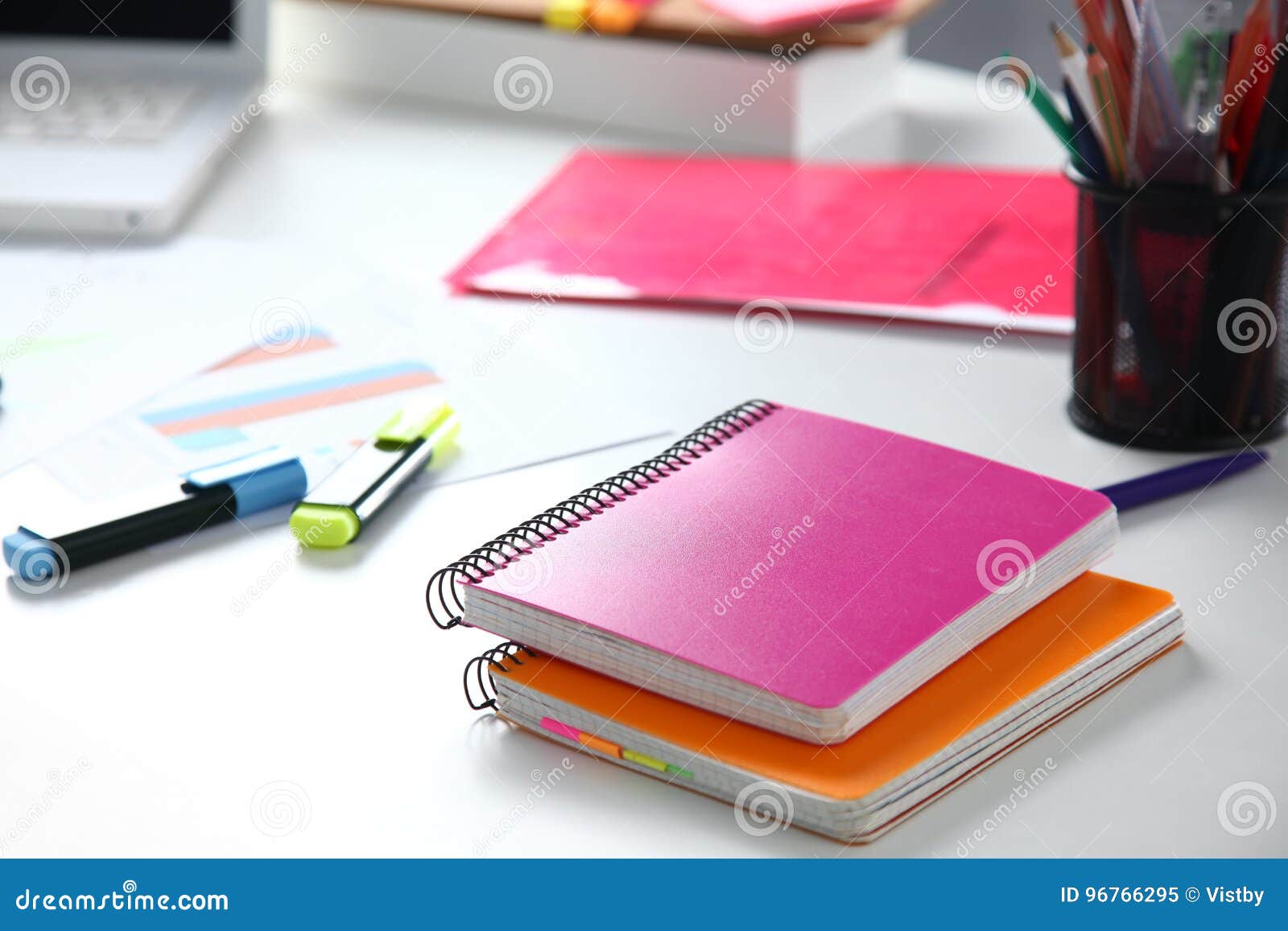 Closeup of White Desktop with Notepads, Pen and Other Items. Selective ...