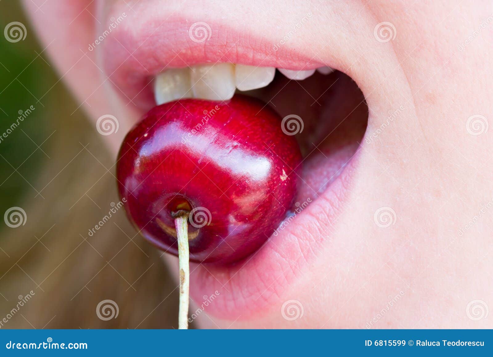 Closeup Of A Woman Biting A Cherry Picture. Image: 6815599