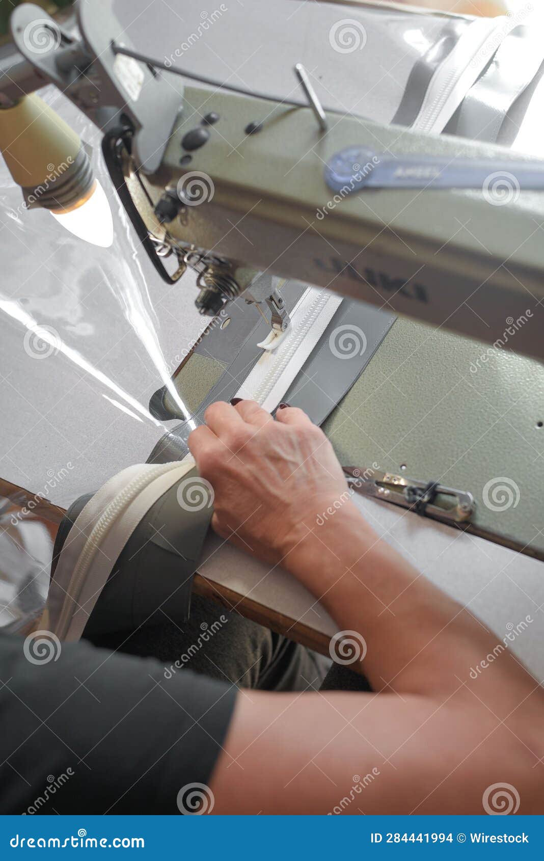 Closeup of a Woman Carefully Sewing a Piece of Fabric on a Sewing ...
