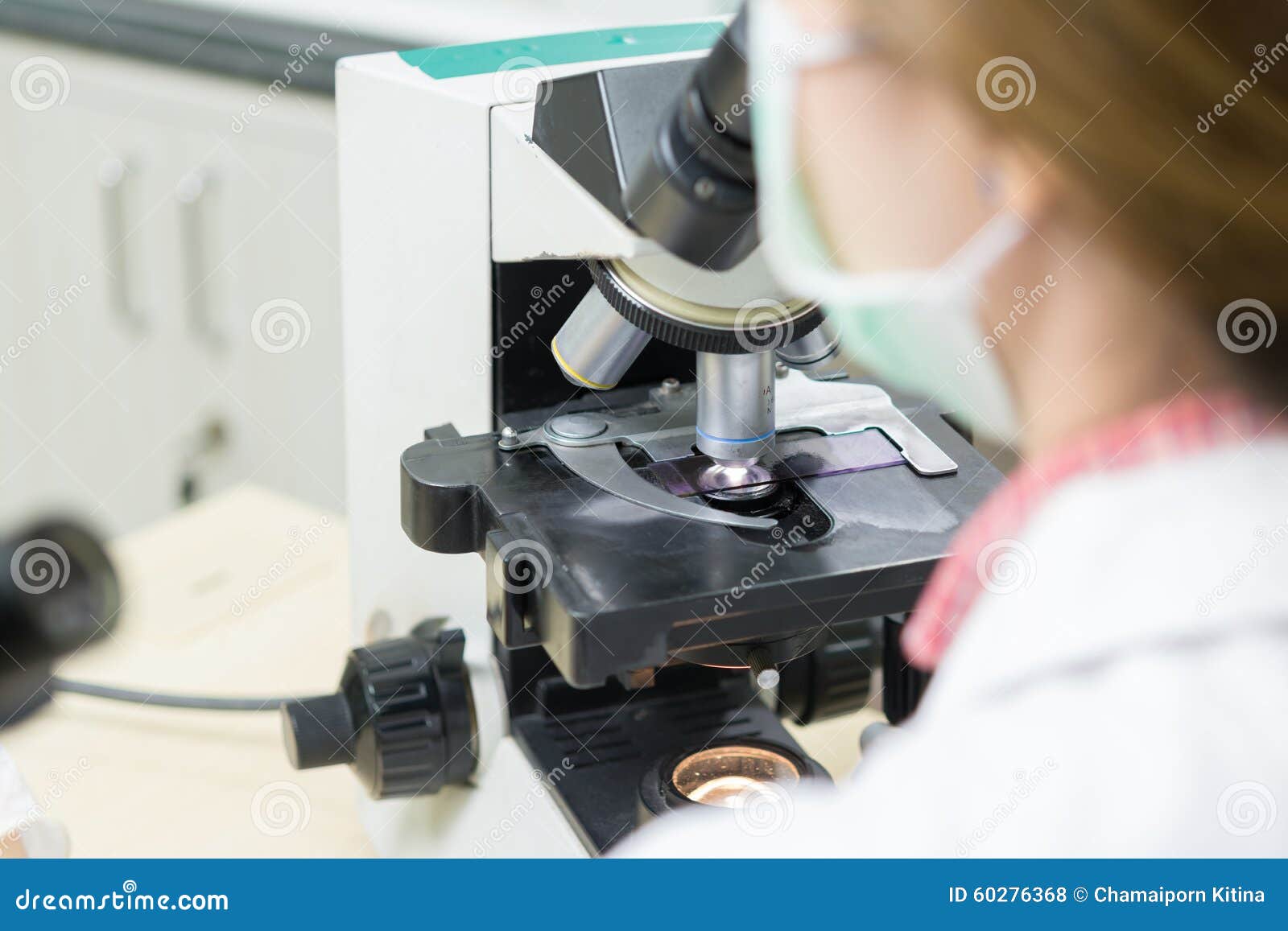 Closeup of Woman Doctor Viewing through Microscope Stock Photo - Image ...