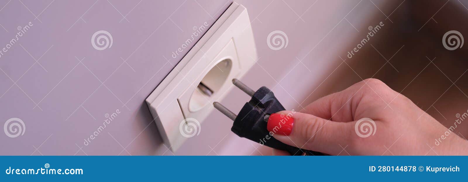 Closeup of Woman Holding in Hand Inserts Plug into Socket Stock Photo ...