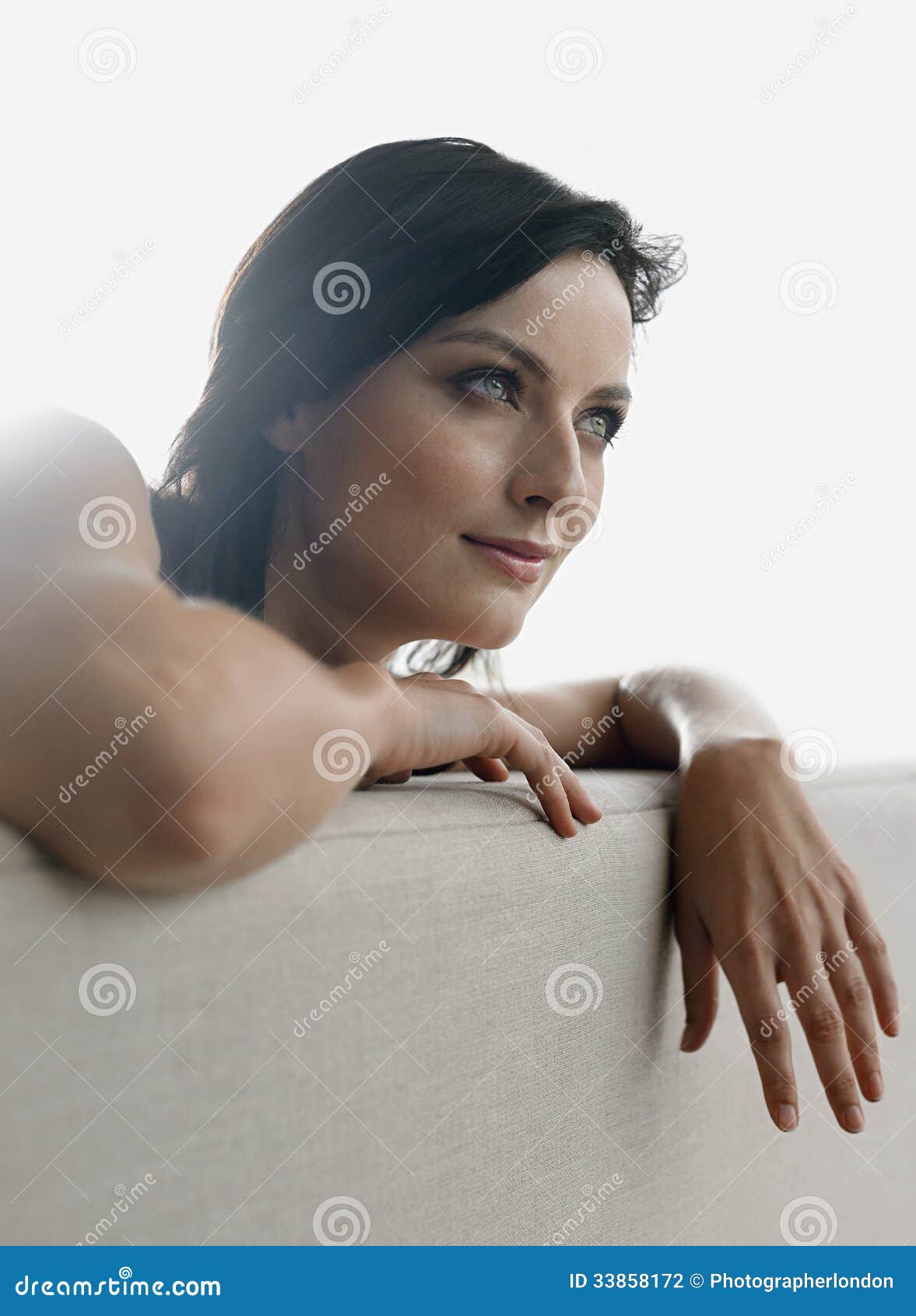 Closeup of Woman Leaning on Couch Stock Photo - Image of closeup ...