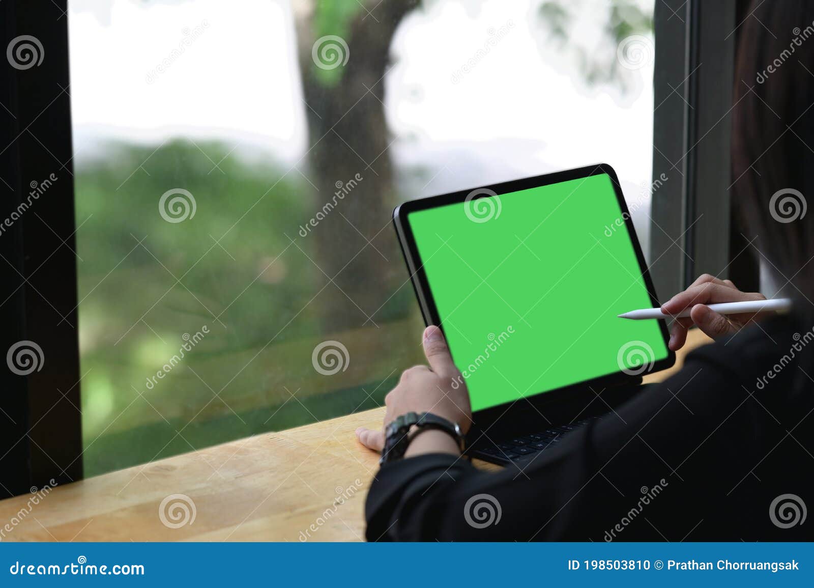 Closeup Woman Using Stylus Pen on Green Screen of Digital Tablet. Stock ...