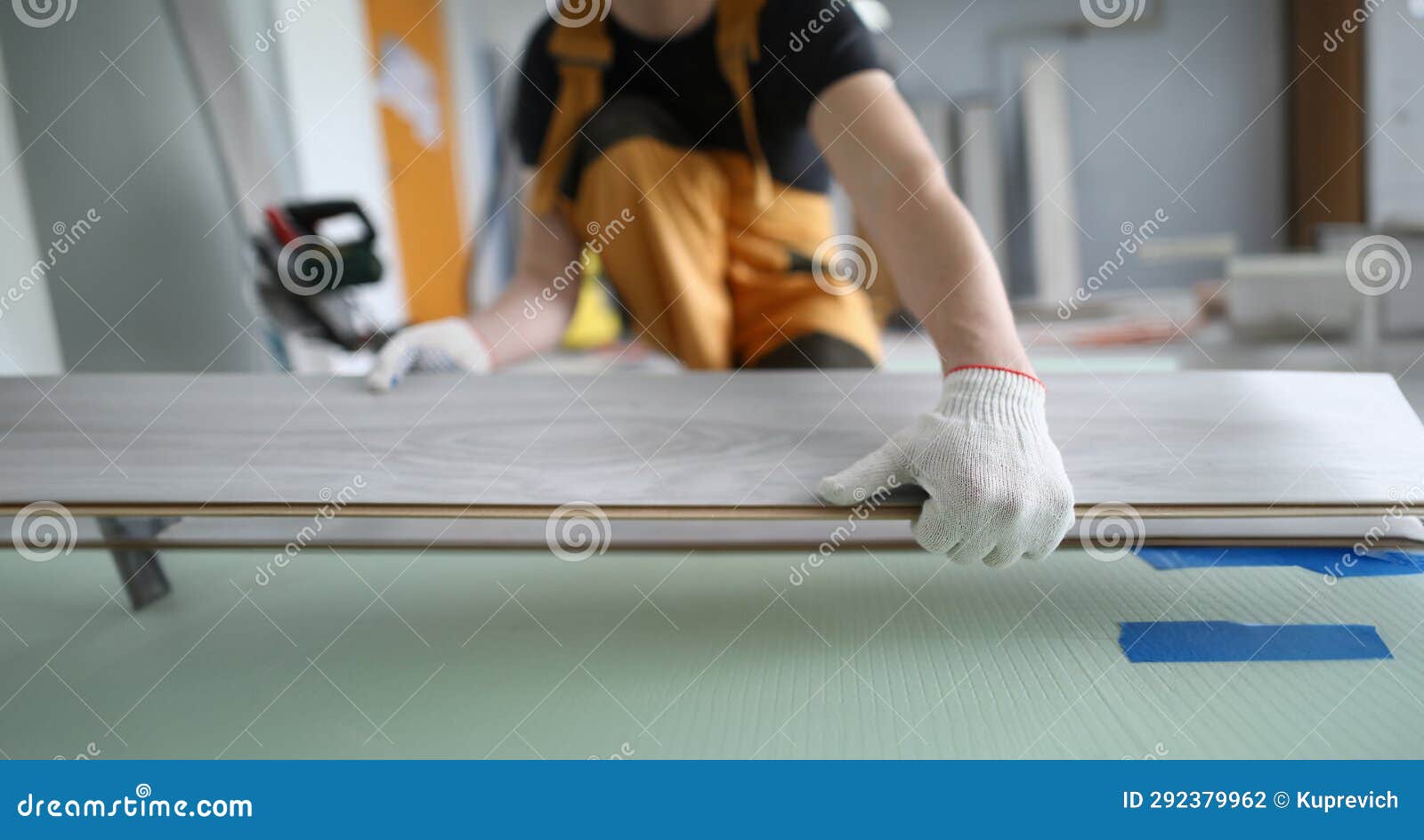 Closeup of Work of Master on Installation of Flooring Stock Photo ...