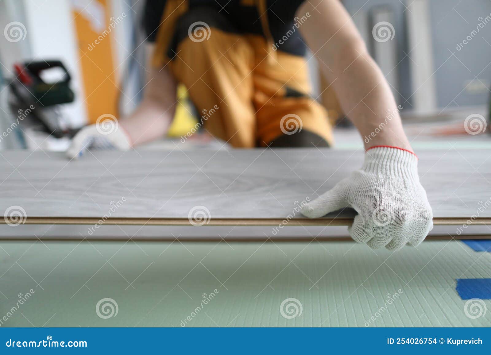 Closeup of Work of Master on Installation of Flooring Stock Photo ...