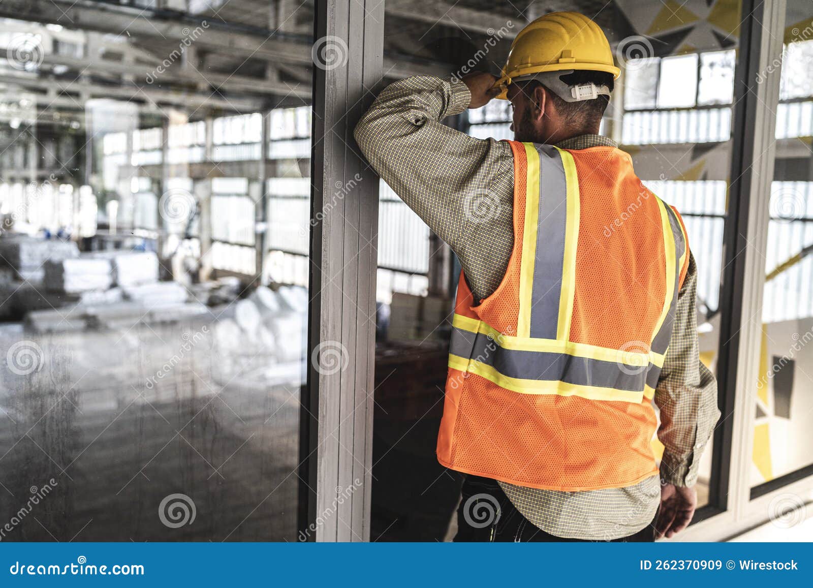 Closeup of the Worker Standing in Front of the Windows and Looking ...