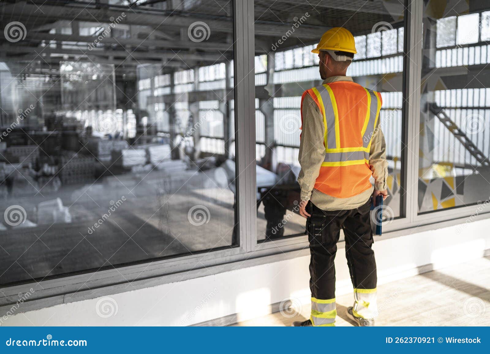 Closeup of the Worker Standing in Front of the Windows and Looking ...