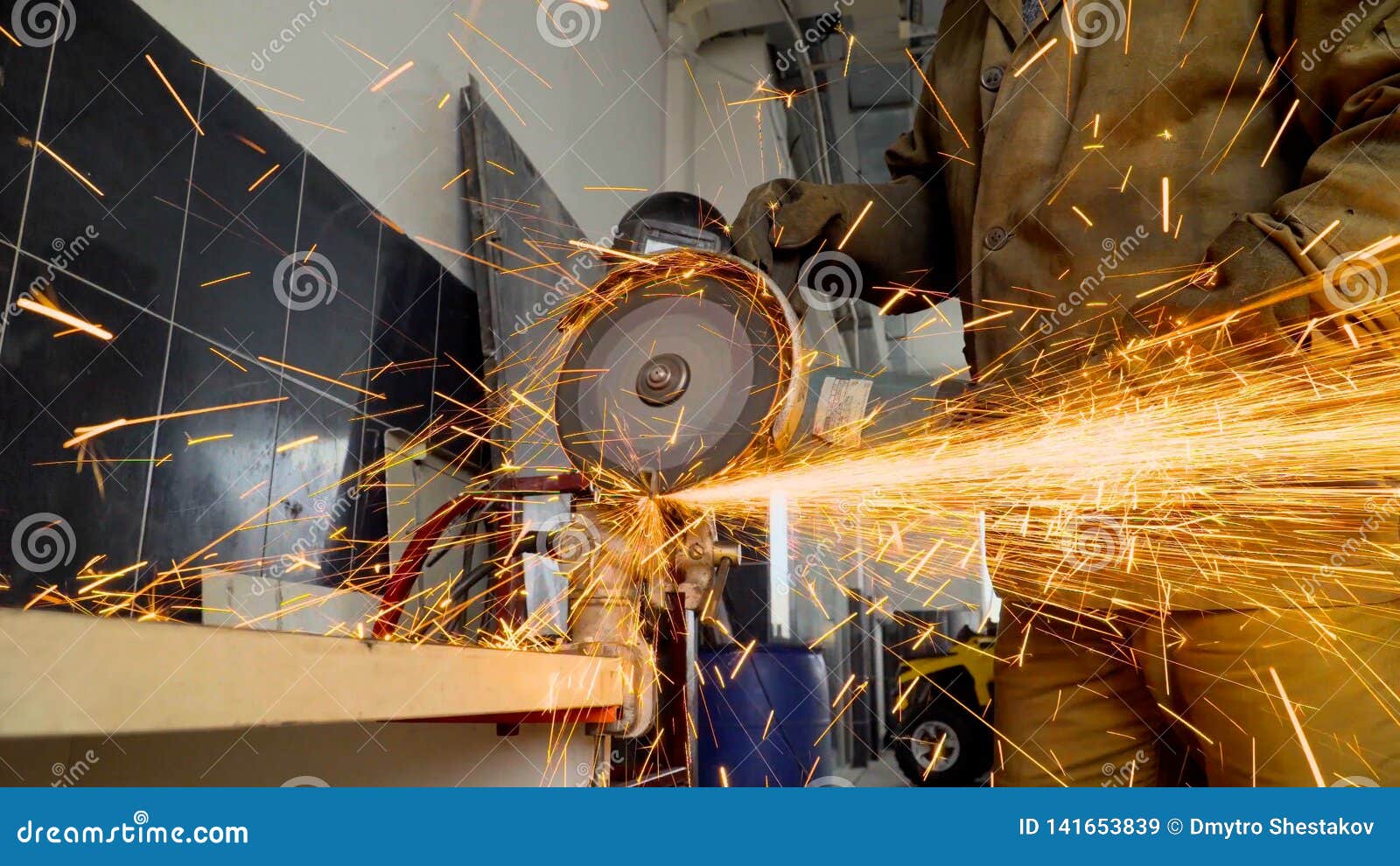 Closeup of Worker Using a Grinder Cuts Metal in a Workshop Stock Image ...