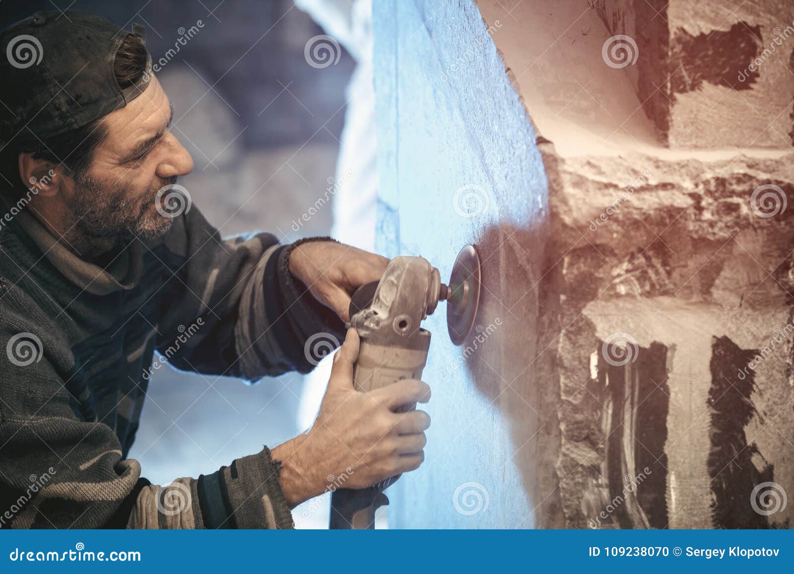 Closeup of a Worker Who Processes Granite Using a Grinding Machine ...