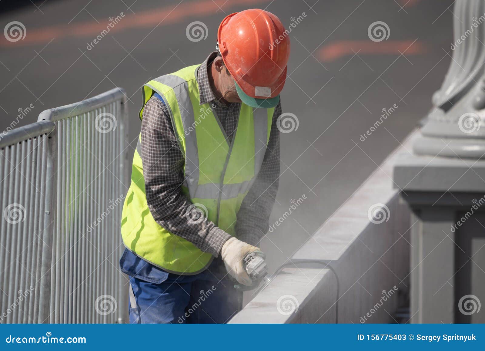 Closeup of a Worker Who Processes Granite Using a Grinding Machine ...