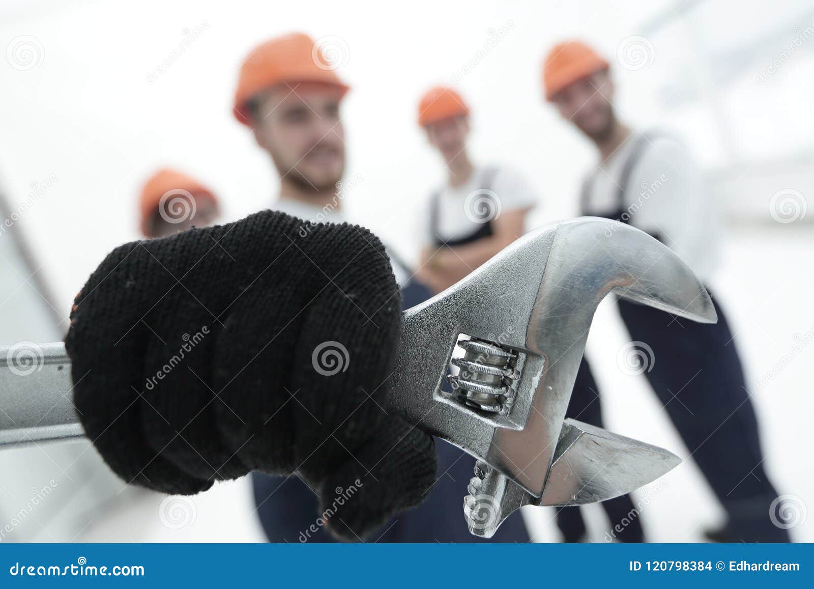 Closeup. the Wrench in the Hands of the Builders Stock Photo - Image of ...