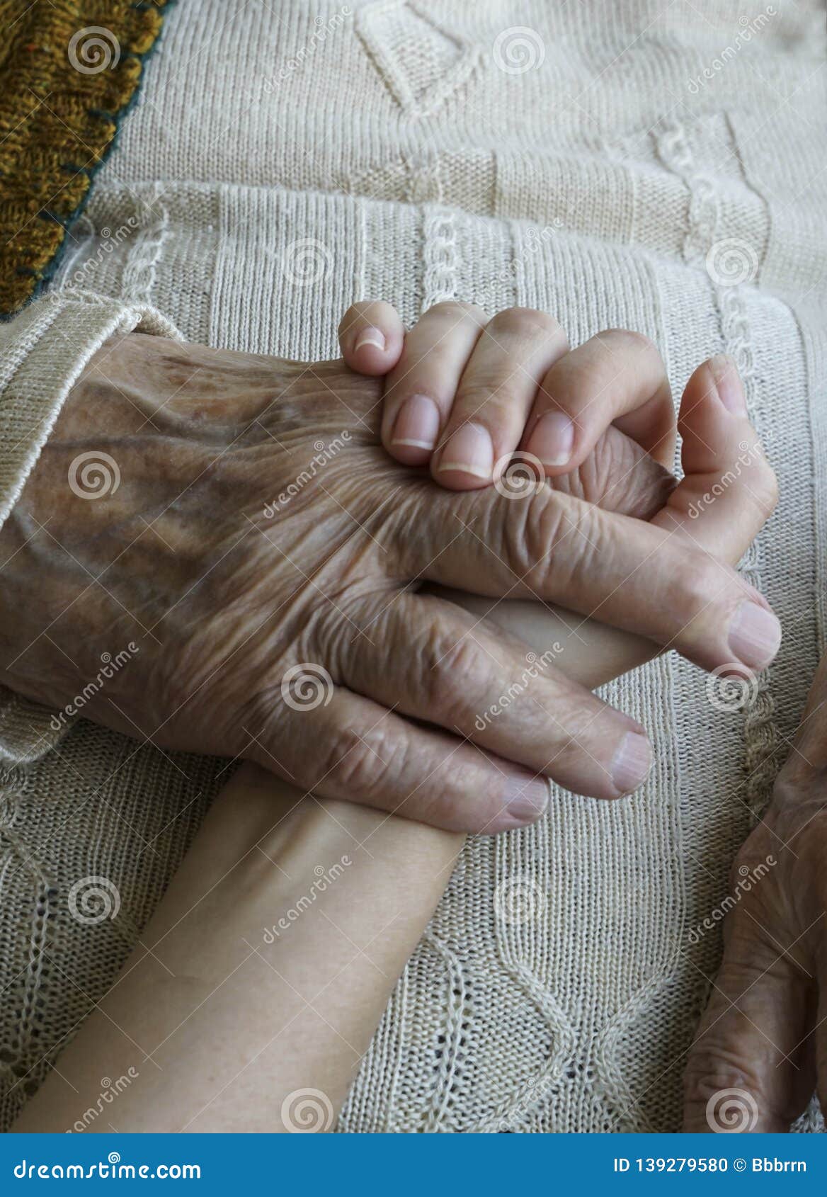 Closeup Wrinkled Hand Holding a Younger Hand Stock Photo - Image of ...