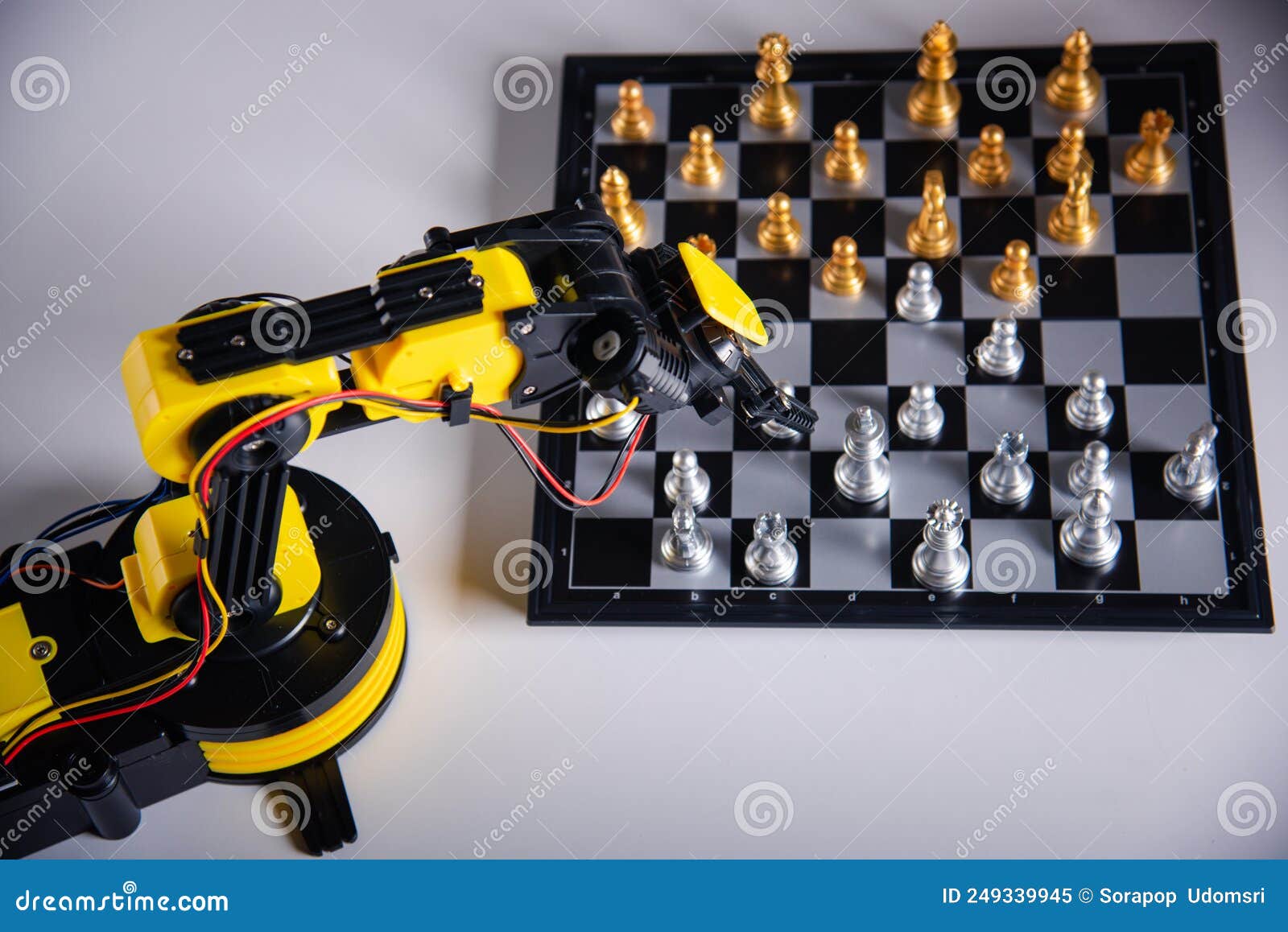 Closeup Yellow Robot Arm Playing Move Chess on Chessboard Stock Image ...
