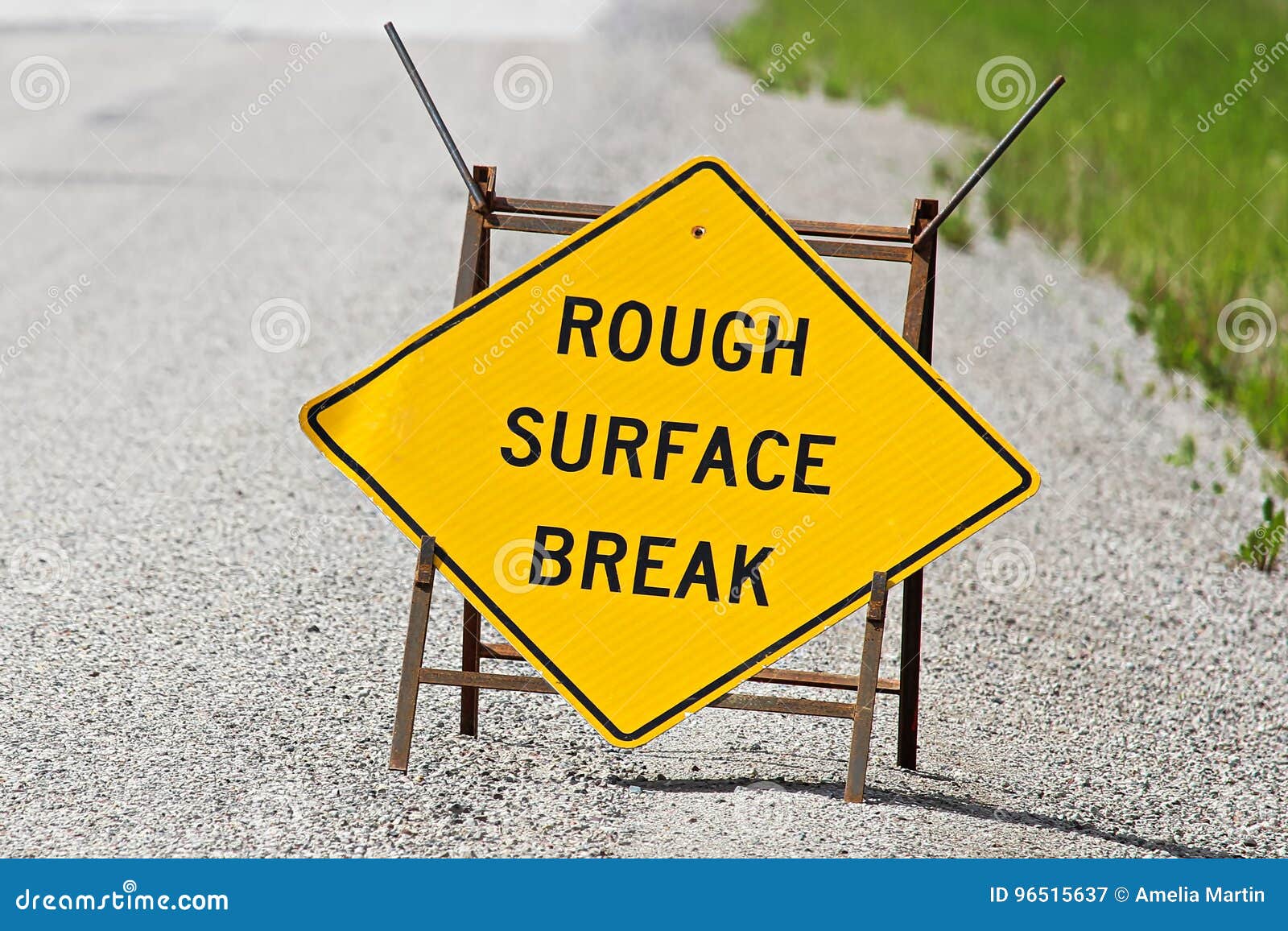 Closeup of a Yellow Rough Surface Break Sign on Pavement Stock Image ...