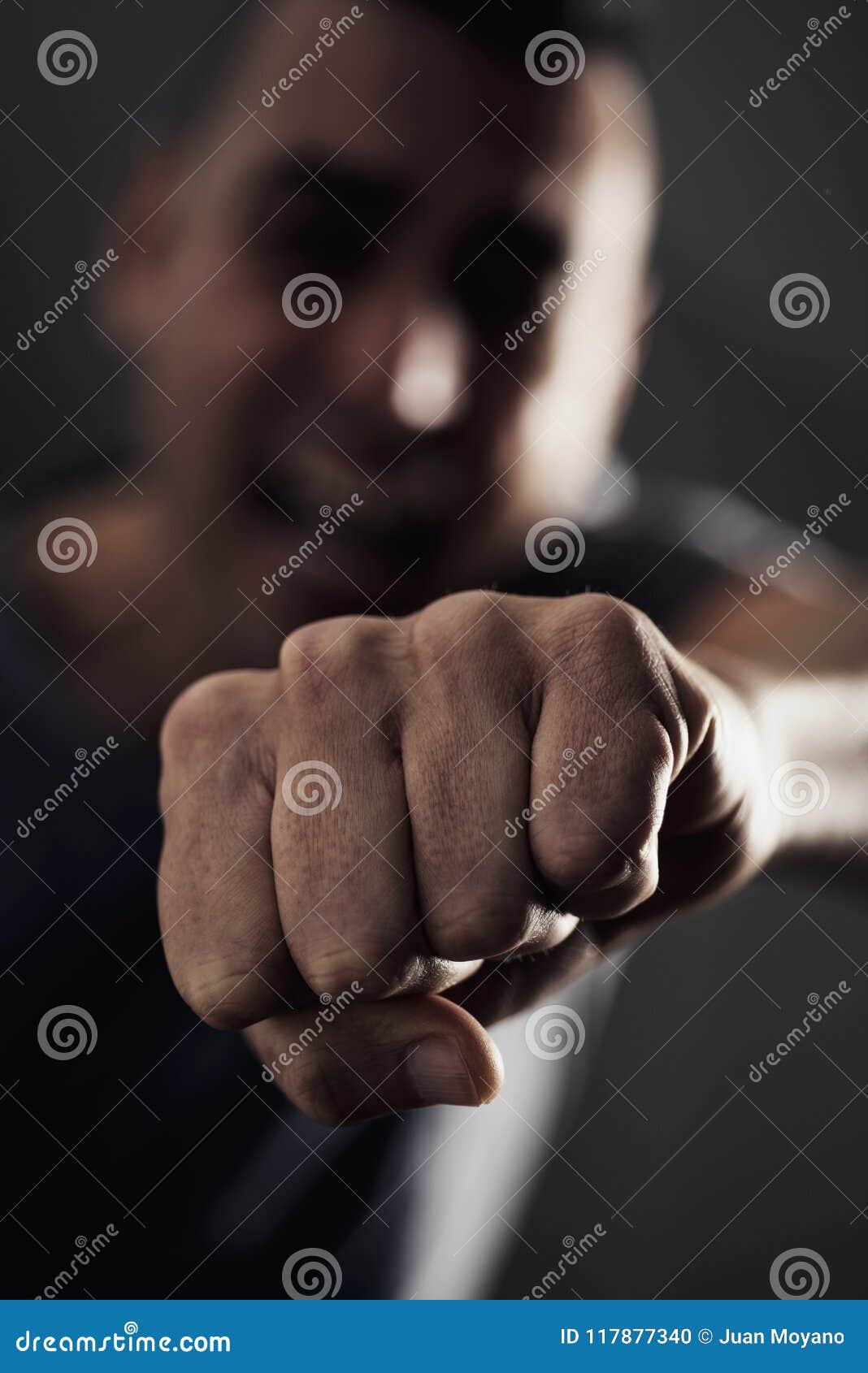 Young man throwing a punch stock photo. Image of fighting - 117877340