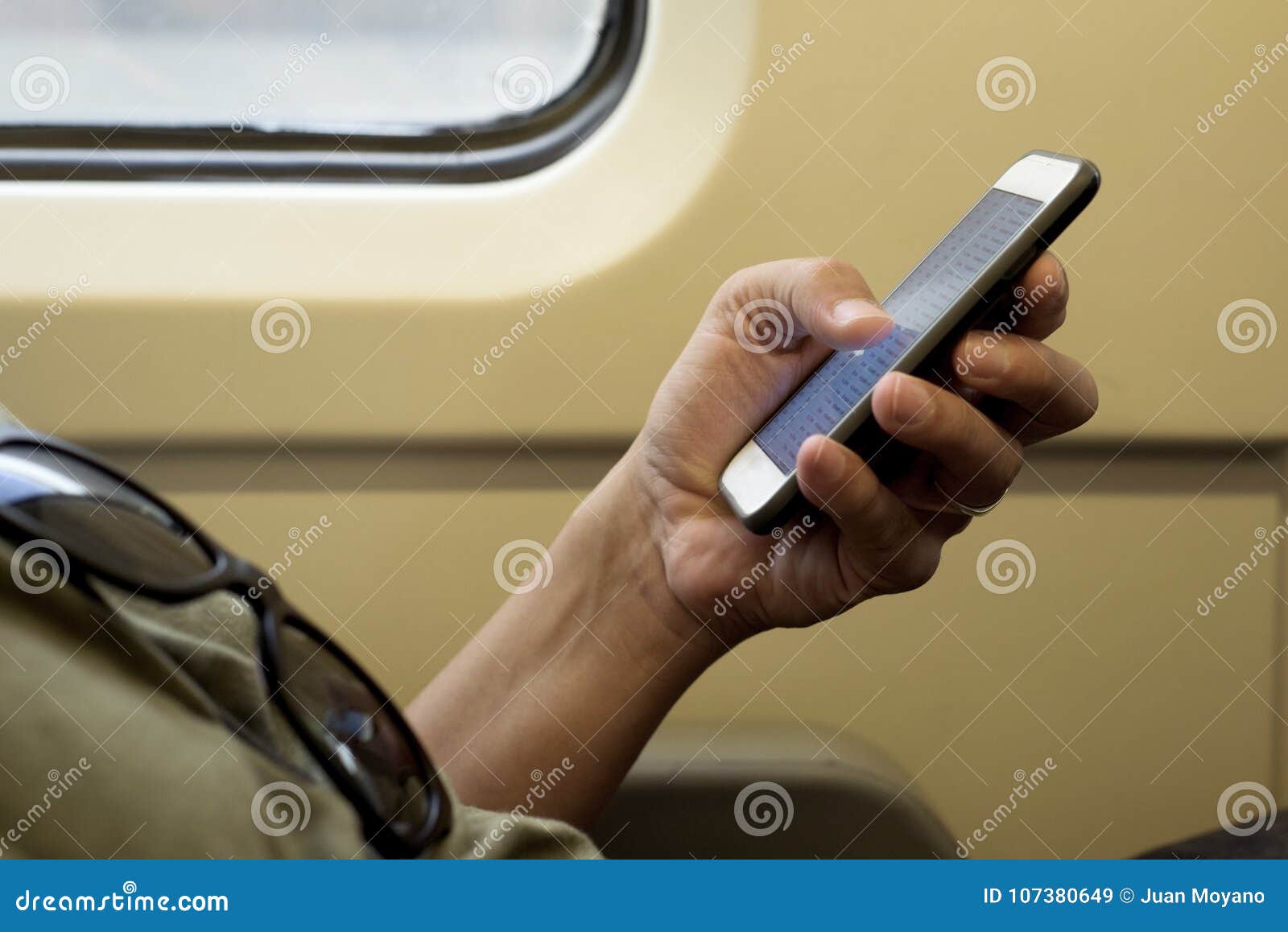 Young Man Using a Smartphone in a Train or Subway Stock Image - Image ...