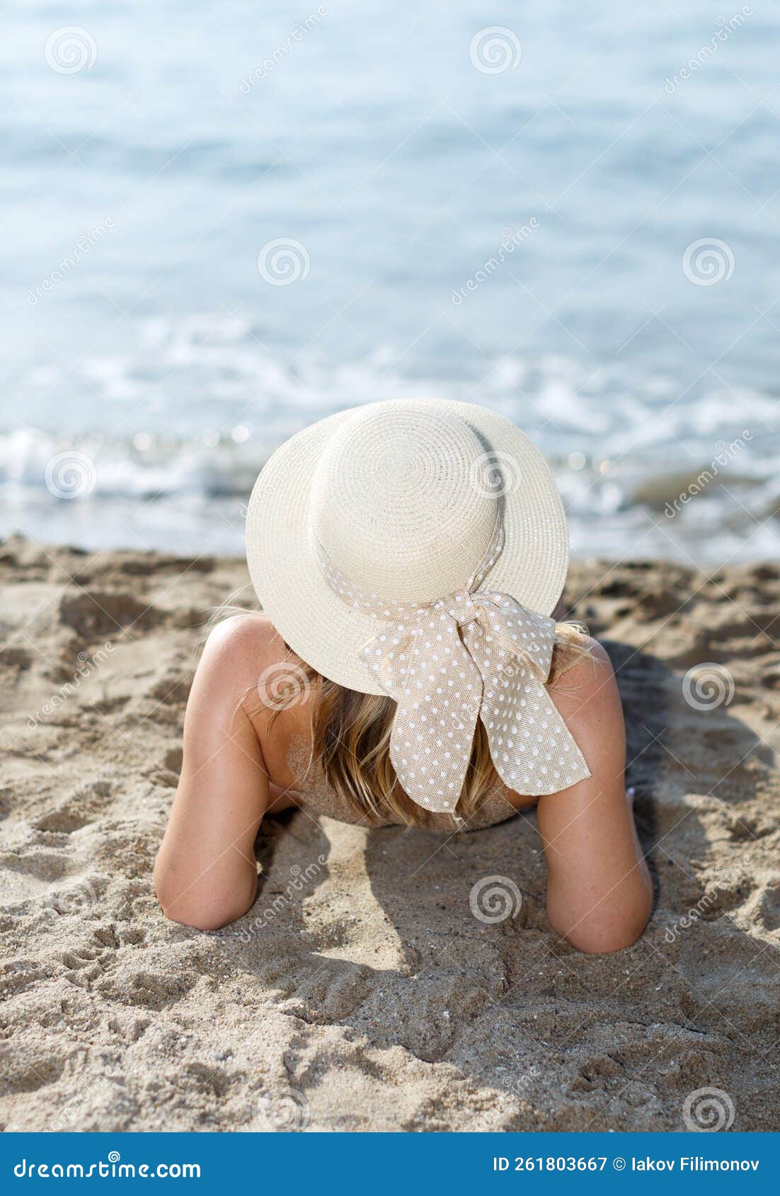 Closeup Of Young Woman In Swimsuit And Hat Taking Sunbath Stock Image