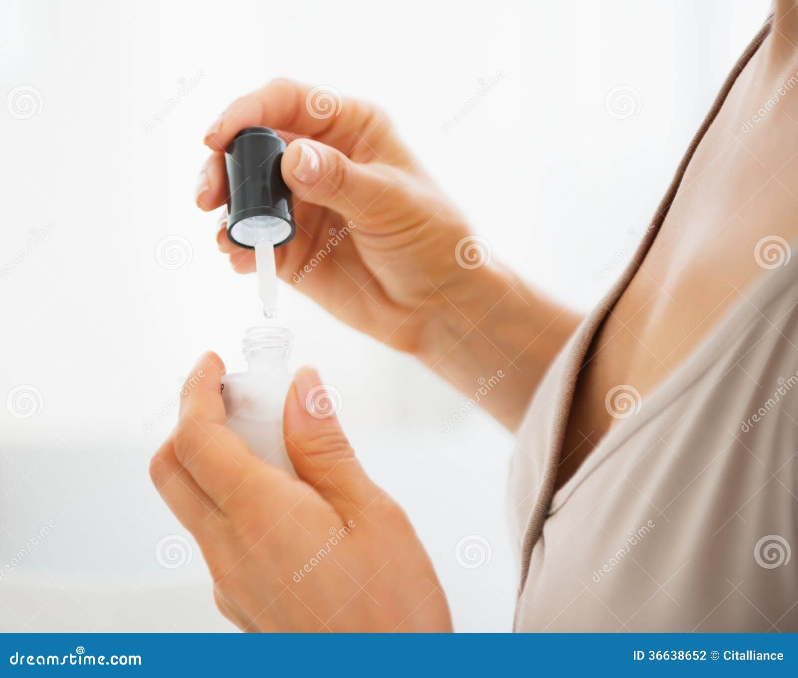 Closeup on Young Woman Using Cosmetic Elixir Stock Photo - Image of ...