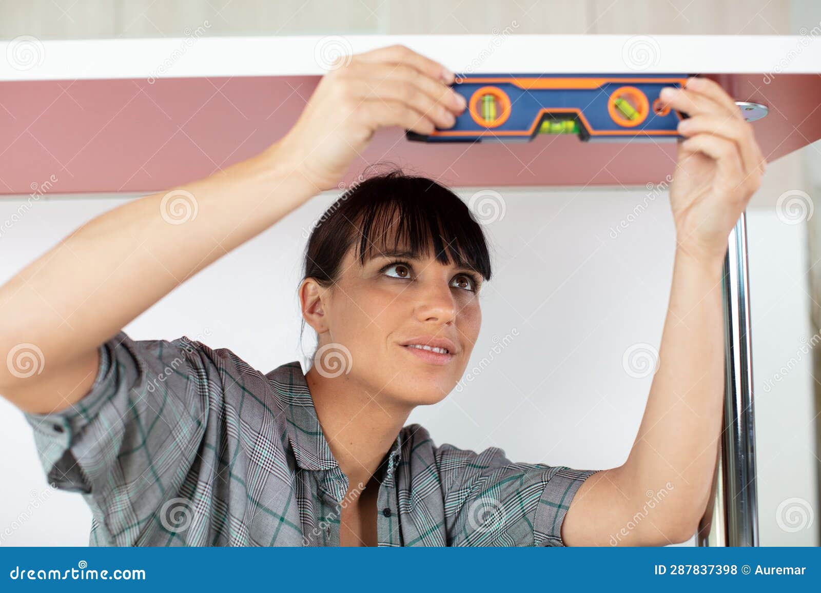 Closeup Young Woman Using Spirit Level Stock Photo - Image of adult ...