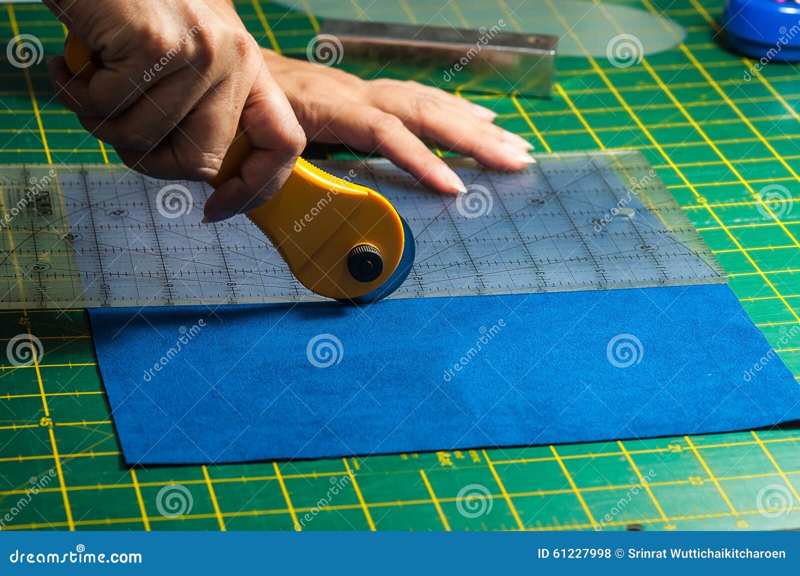 Cloth cutting process stock photo. Image of tool, hands - 61227998