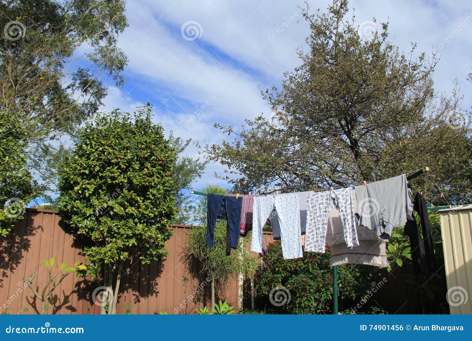 Cloth drying in backyard stock photo. Image of homework - 74901456