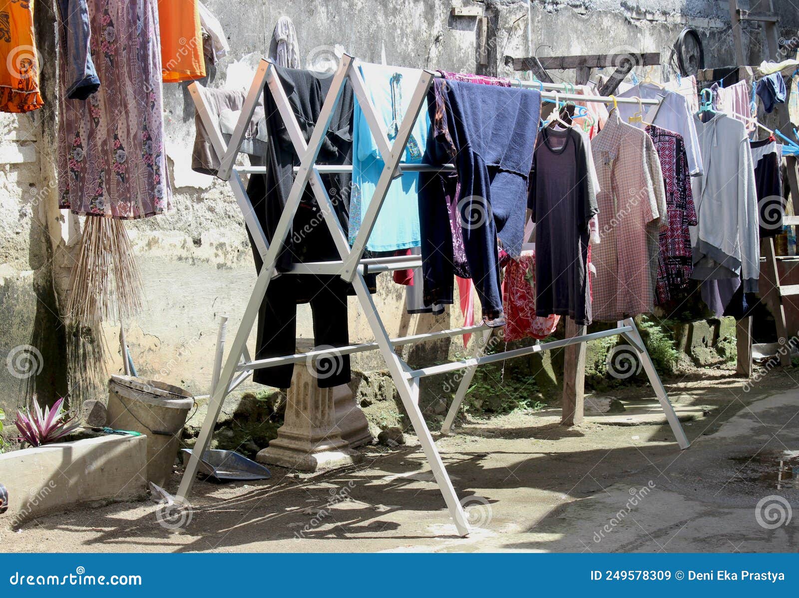 Sun-dried clothes stock image. Image of street, pedestrian - 249578309