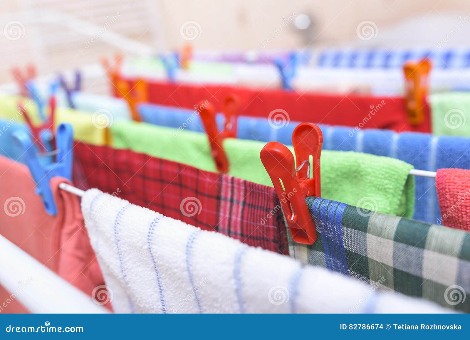 Clothes dryed on a dryer. stock photo. Image of colour - 82786674
