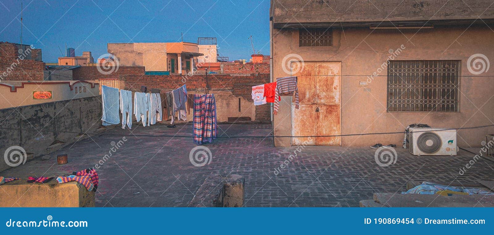 Clothes drying on rooftop editorial stock image. Image of clothes ...