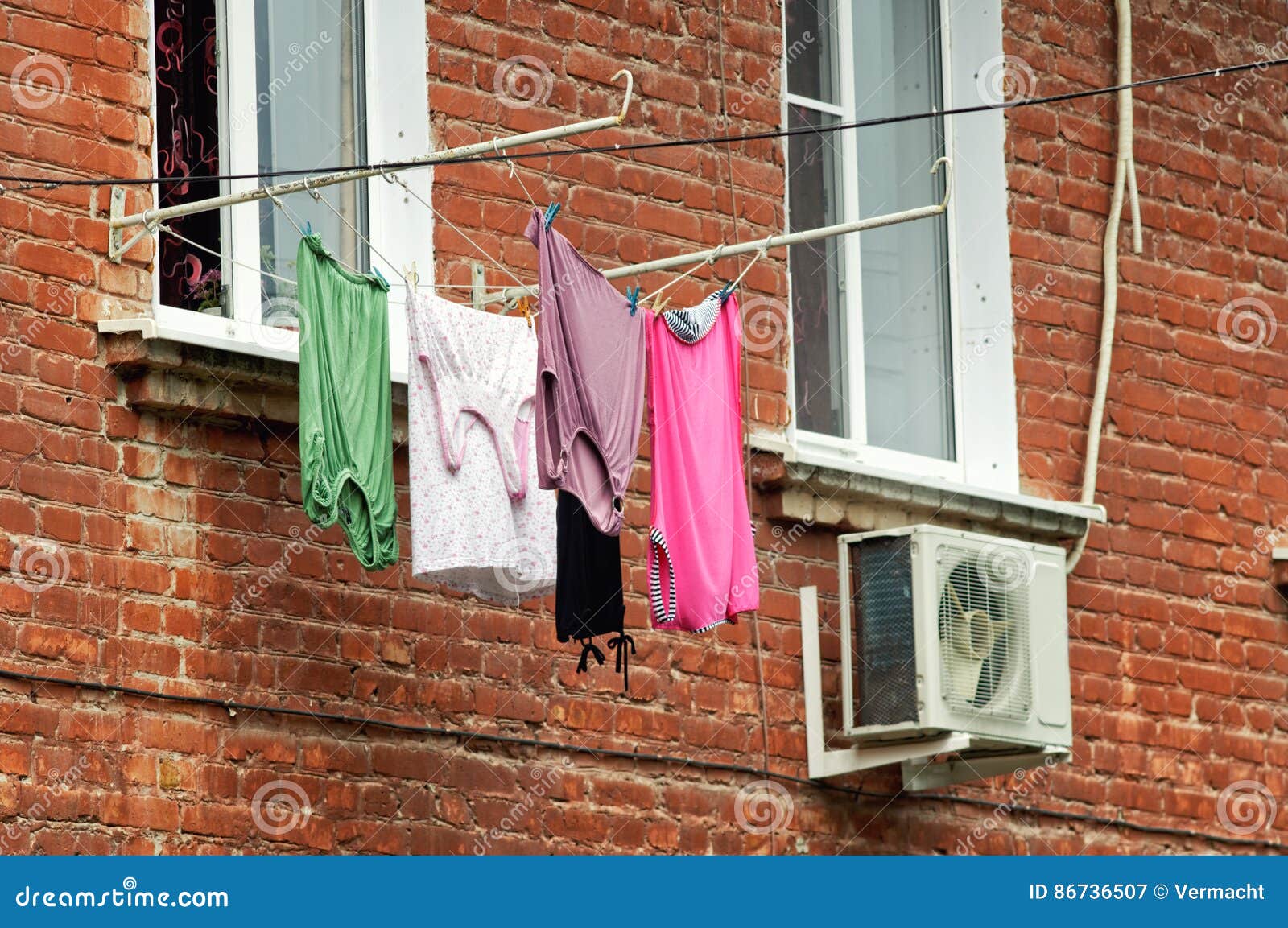 Clothes Drying on a Rope Under a Window Stock Image - Image of pegs ...