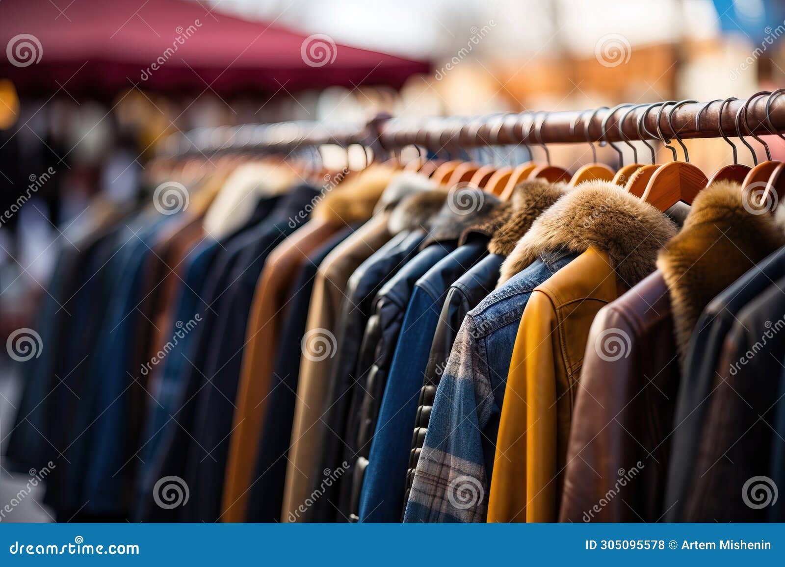 Clothes Hang on a Rack in a Clothing Store. Stock Photo - Image of ...