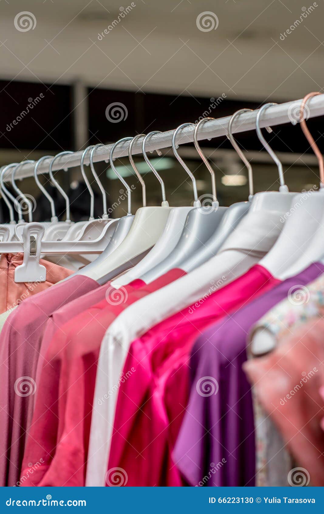 Clothes Hang on a Shelf in a Clothes Store Stock Photo - Image of ...