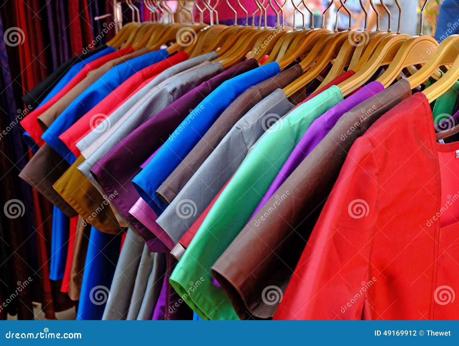Clothes hang on the shelf stock photo. Image of shelf - 49169912