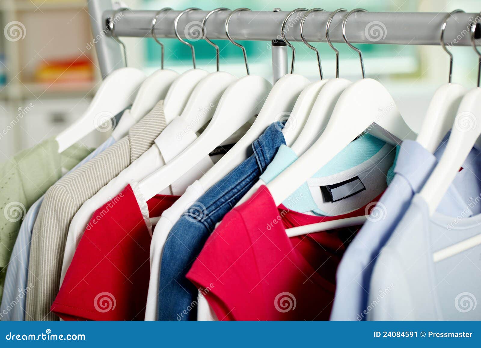 Clothes on hangers stock image. Image of garment, mall - 24084591