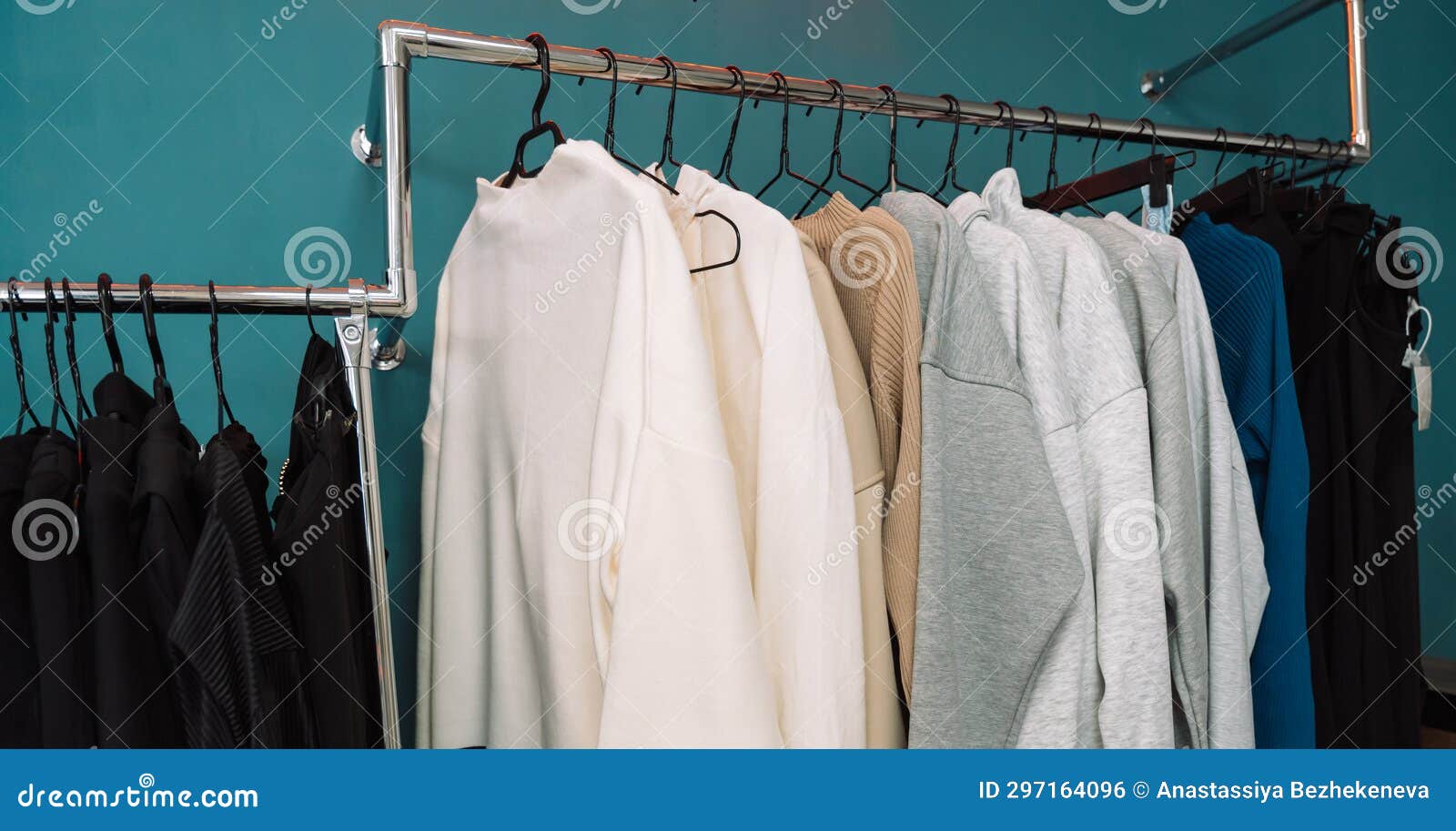 Clothes on Hangers Hang on the Rack in a Clothing Store Stock Photo ...