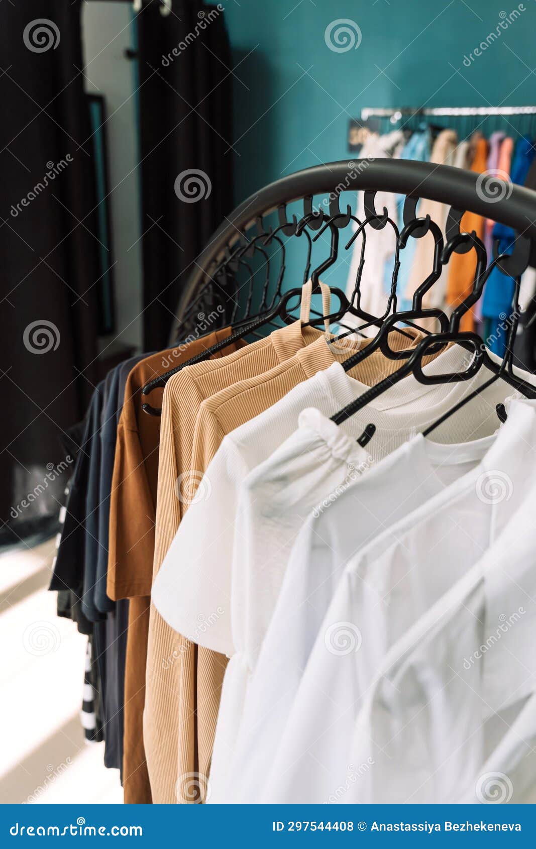 Clothes on Hangers Hang on the Rack in a Clothing Store Stock Photo ...