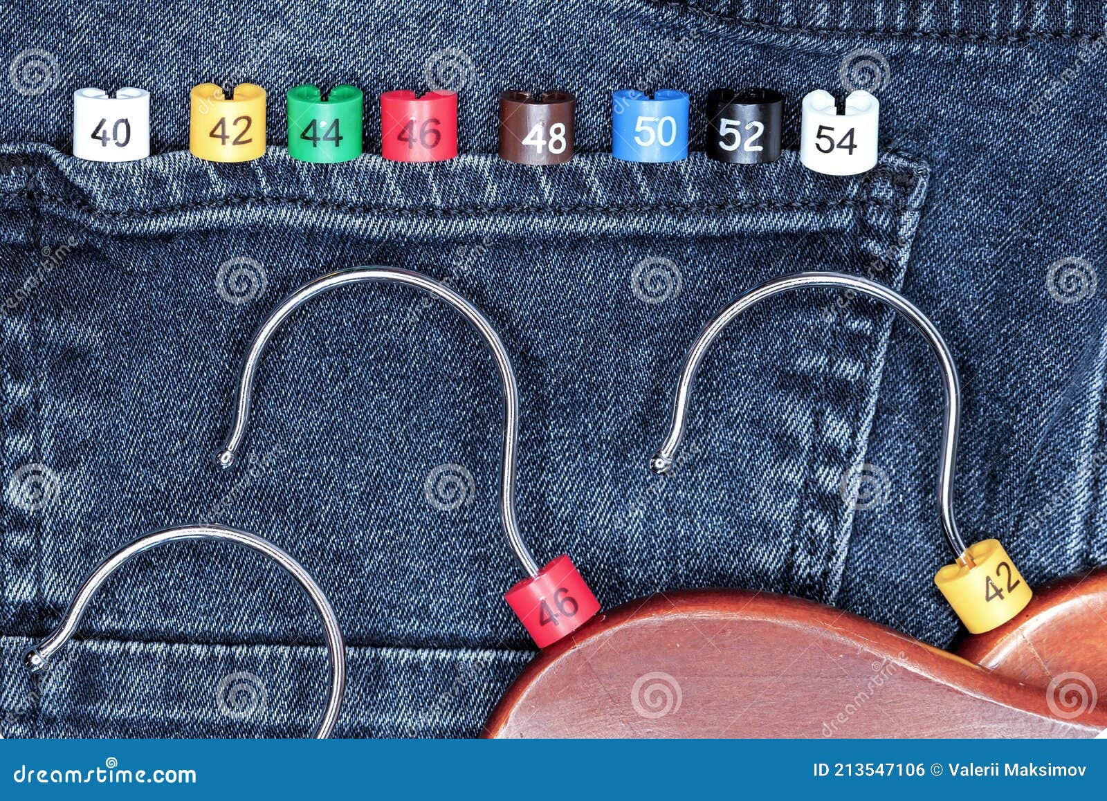 Clothes Hangers with Multicolored Plastic Size Labels on a Denim ...