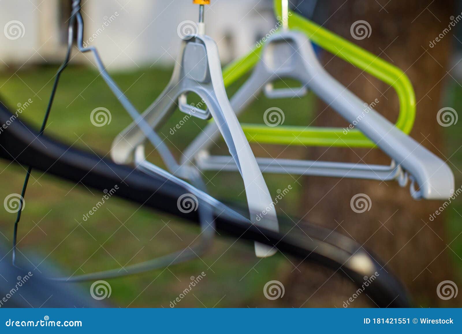 Clothes Hangers of Multiple Colors Behind Each Other in a Line Stock ...