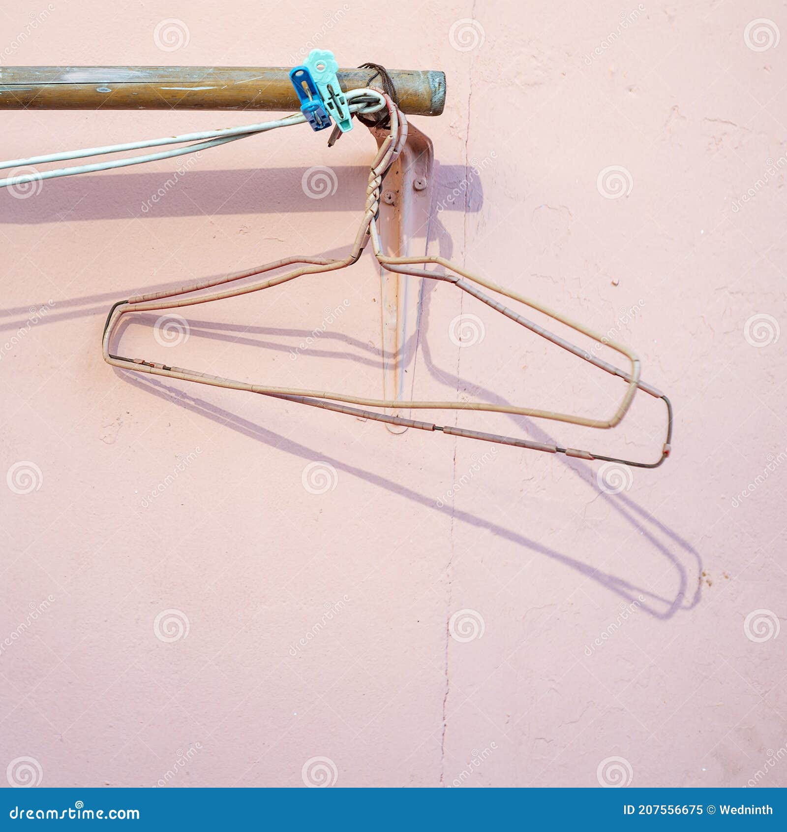 Clothes Hangers and Shadow of Rack in the Background Stock Image ...