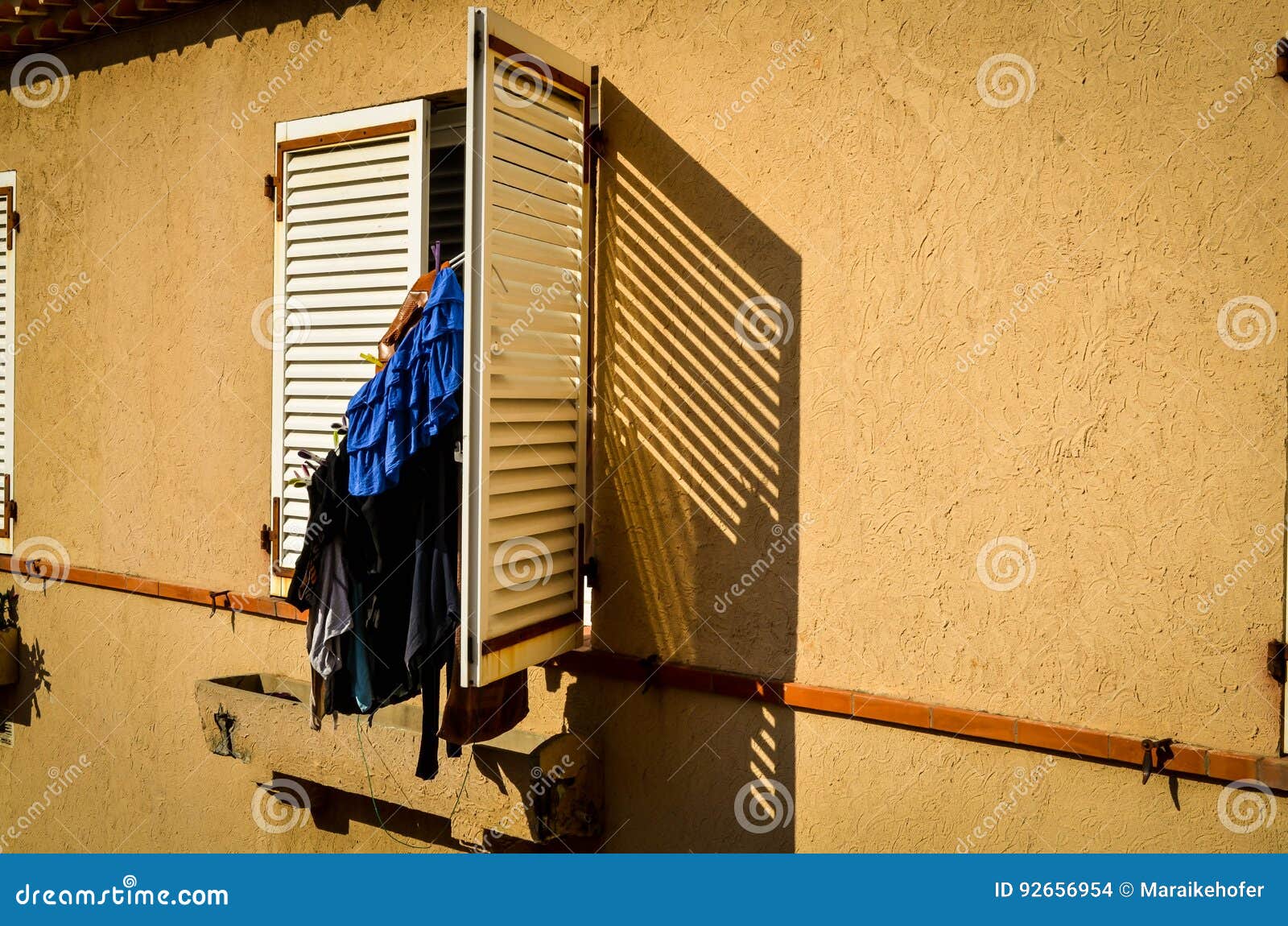 Clothes Hangin on Window Shutter Stock Photo - Image of ancient, home ...