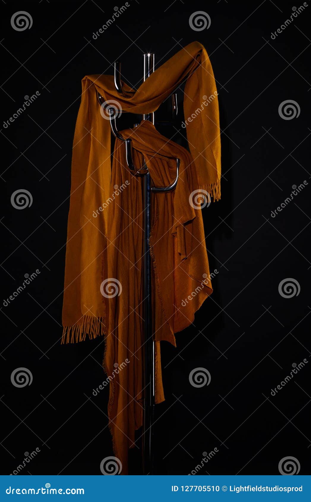 Clothes Hanging on Coat Rack on Black Stock Photo - Image of hatstand ...