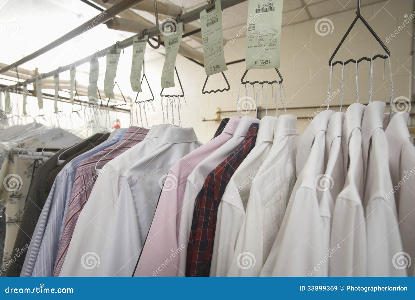 Clothes Hanging on Hanger in Laundry Stock Image - Image of small, bill ...