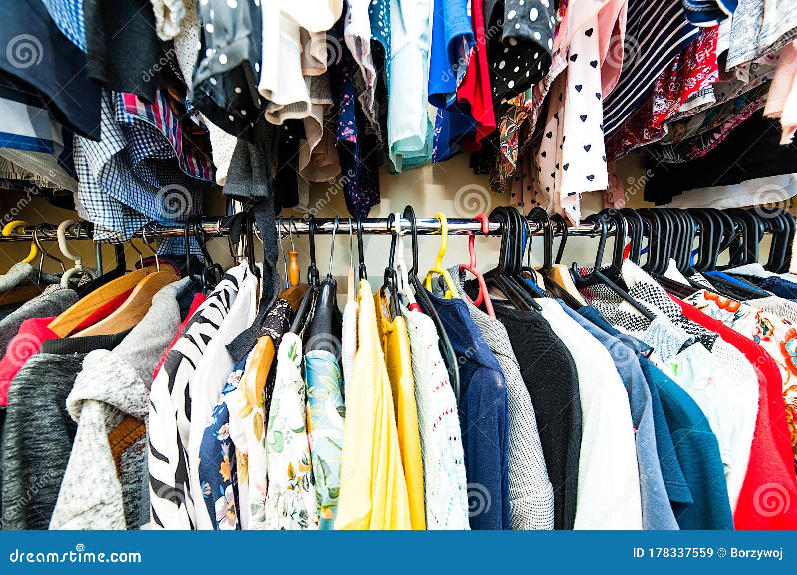 Clothes hanging on hangers stock image. Image of house - 178337559