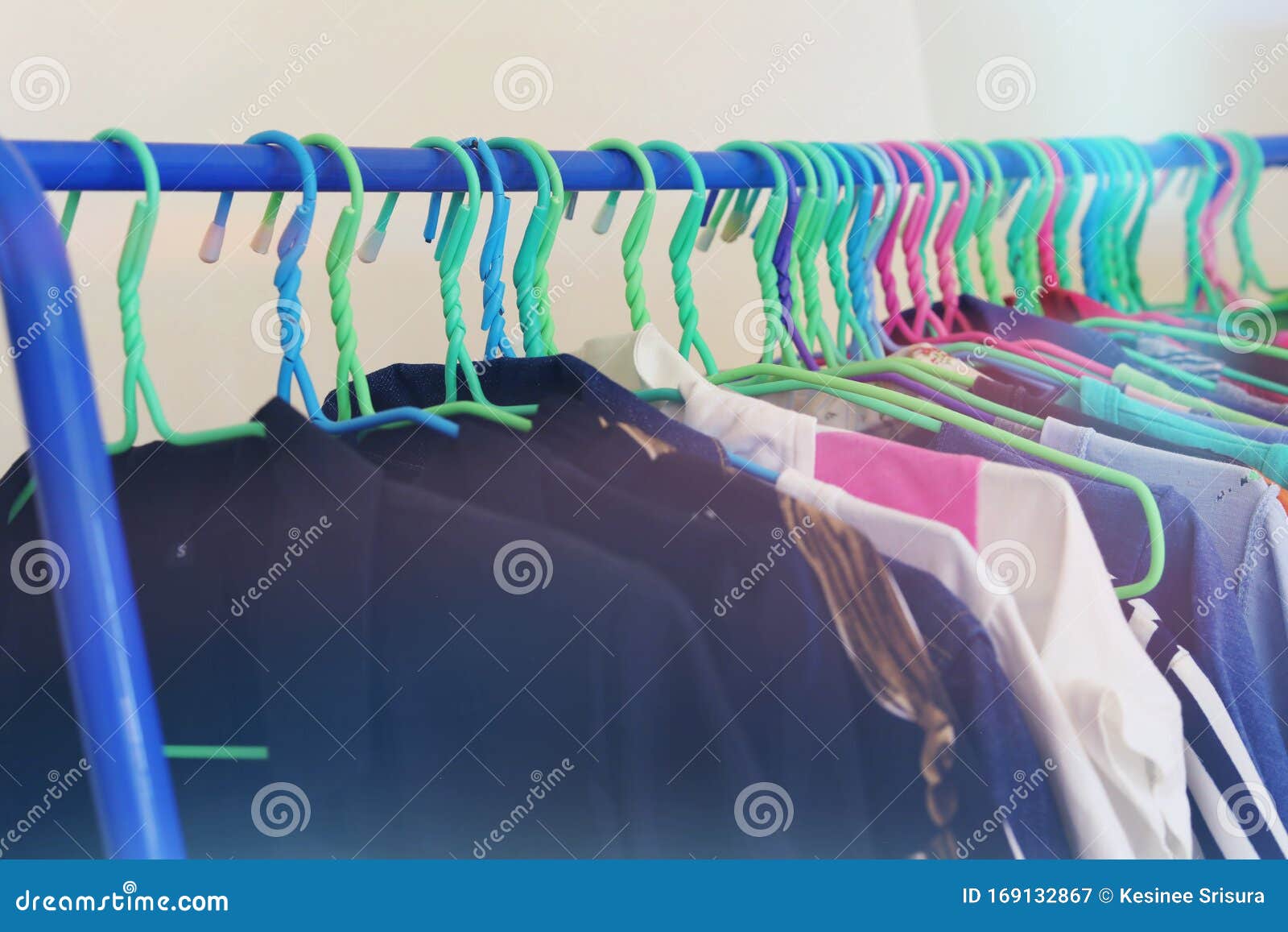 Clothes Hanging on Rack with Light Effect Stock Image - Image of hanger ...