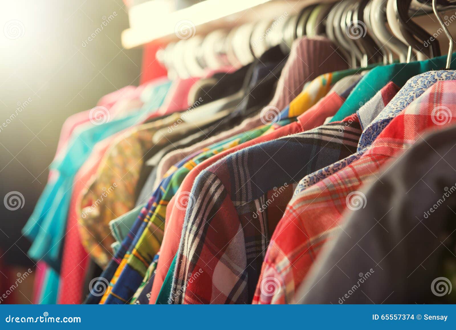 Clothes Hanging on the Rack in the Store Stock Photo - Image of shirt ...