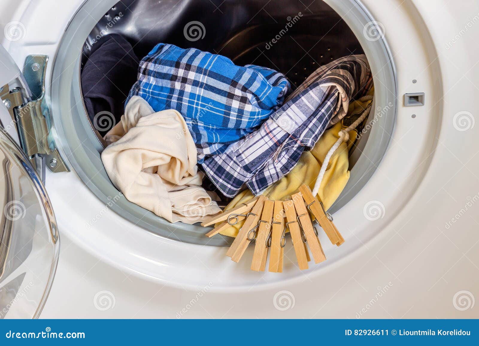 Clothes Inside of Washing Machine Taken Closeup. Stock Image - Image of ...