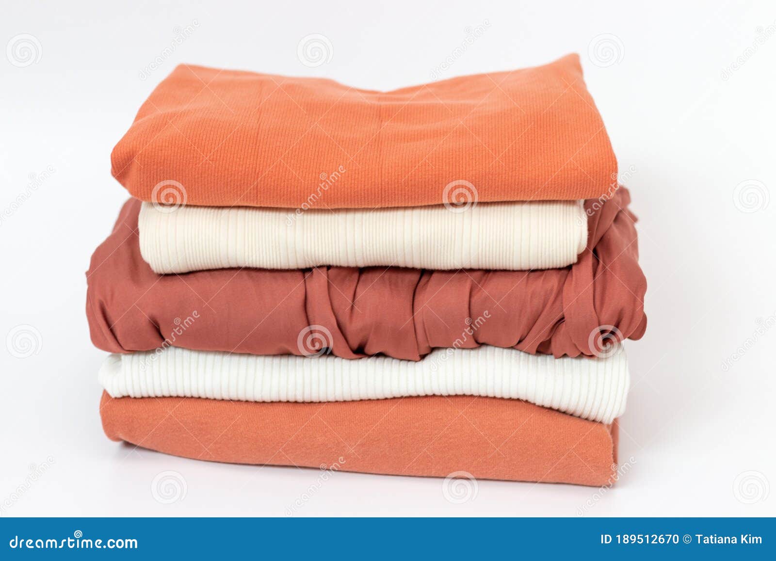 Clothes Neatly Folded into Stack on White Background, Front View Stock ...
