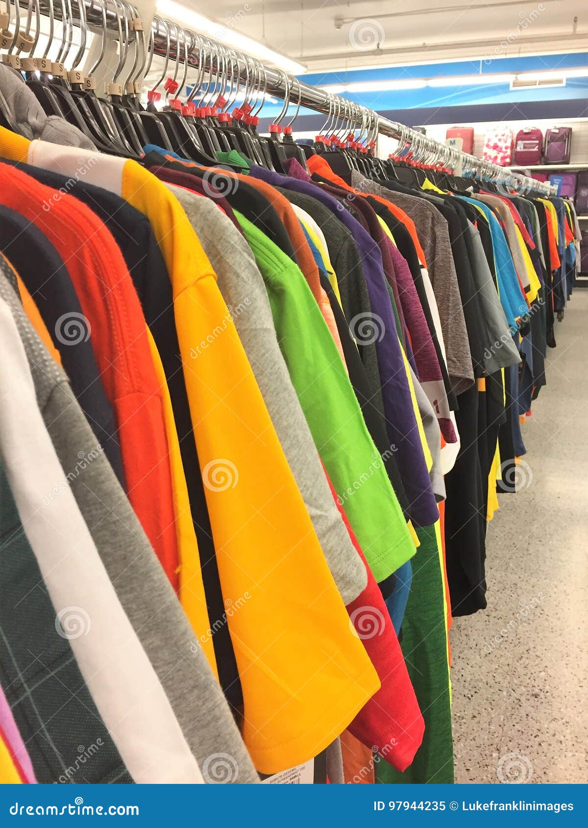 Clothes rack in a shop stock image. Image of discount - 97944235