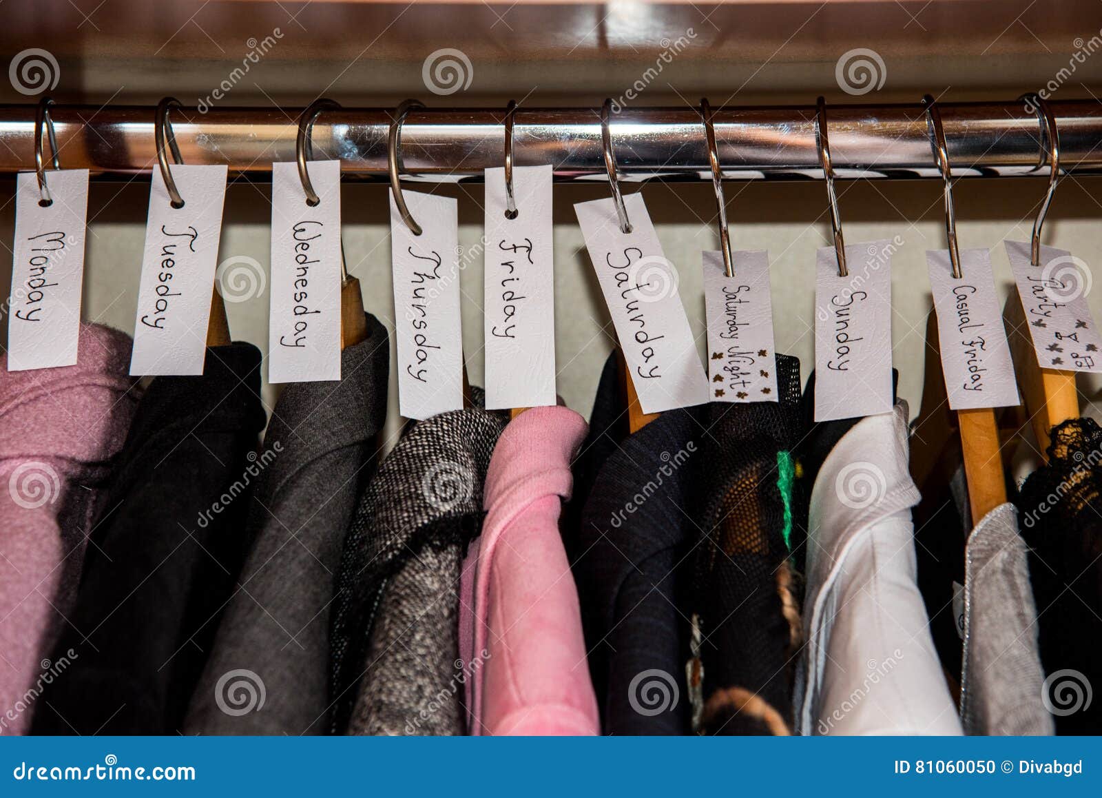 Clothes Sorted by Days in Wardrobe Stock Photo - Image of closet ...